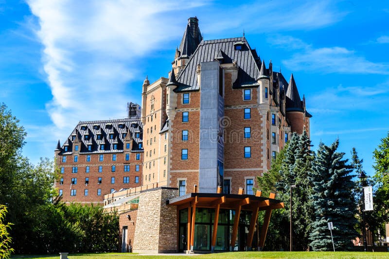 A Large Brick Building with a Steeple and a Large Window Editorial ...