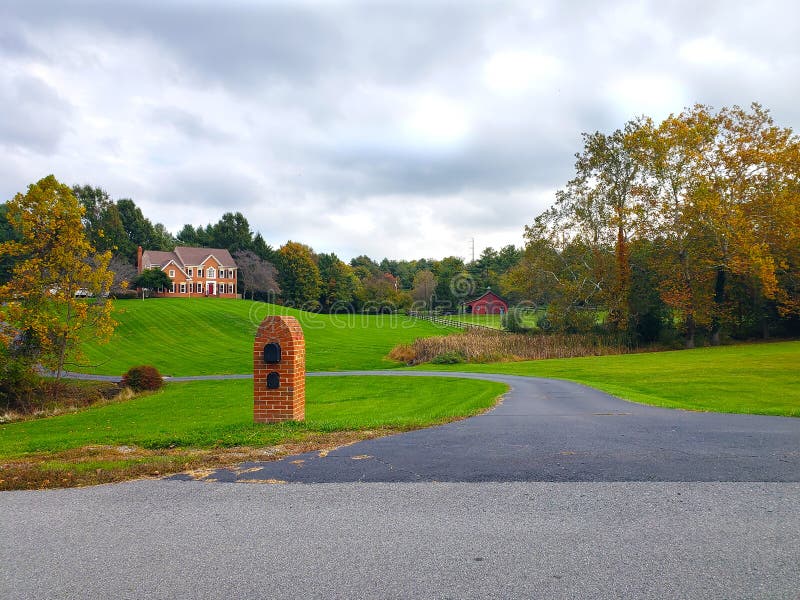 Large Brick Farmer S House. with Big Field Under a Blue Sky Stock Photo ...