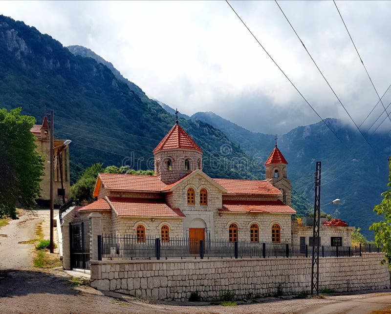 Large Brick Structure in Front of a Majestic Mountain Range in the ...
