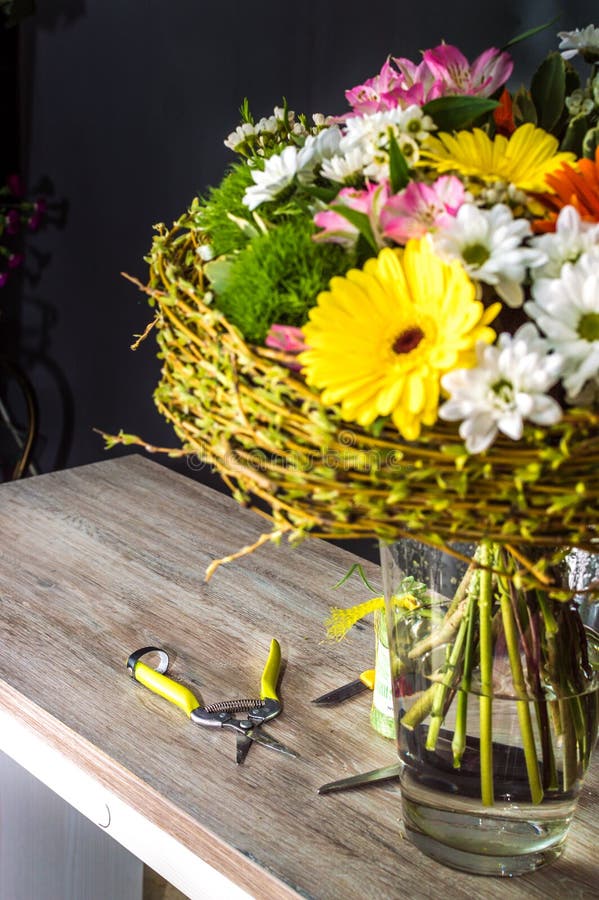 Man working in florist stock image. Image of counter - 20887431