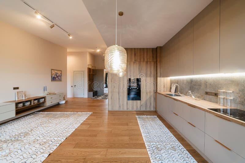 Large, Bright Studio Kitchen with Wood Flooring Stock Photo - Image of ...