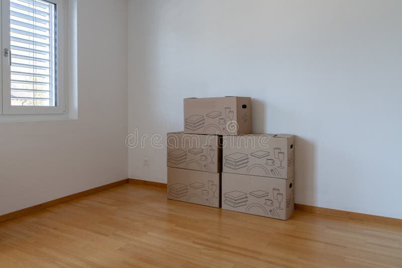 Large Brown Moving and Packing Boxes in an Empty Room Stock Image ...