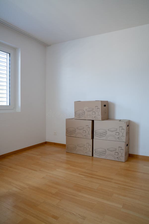 Large Brown Moving and Packing Boxes in an Empty Room Stock Photo ...