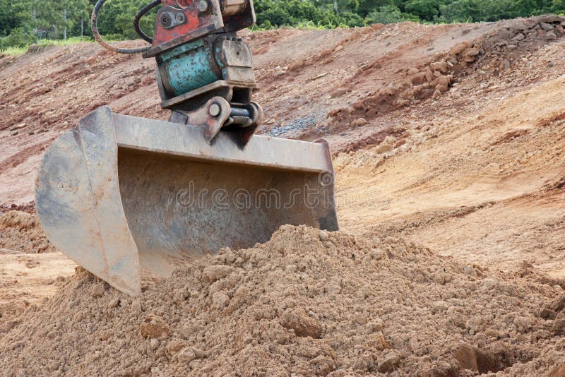Large Bucket Digging Up Soil Stock Image - Image of bulldozer, bucket ...