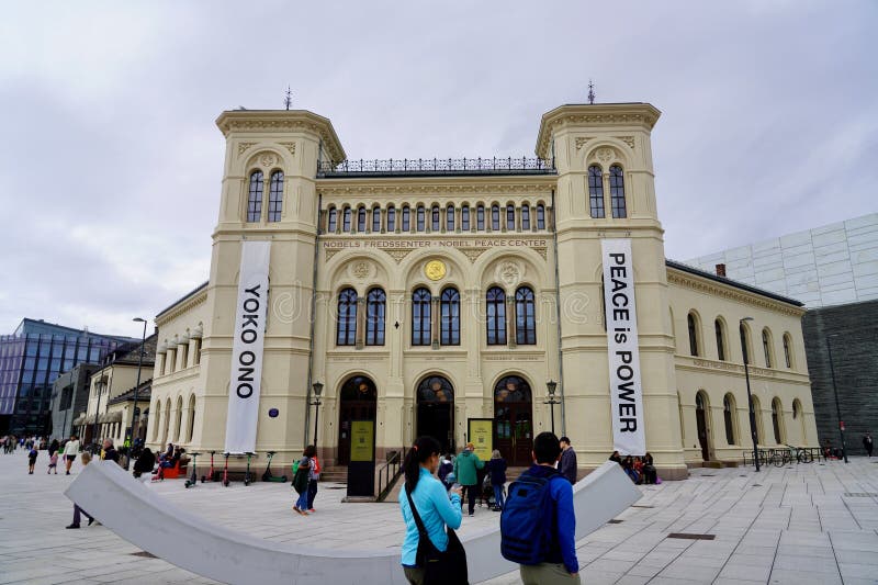 Large Building with Banners and a Crowd Gathered in Front Editorial ...