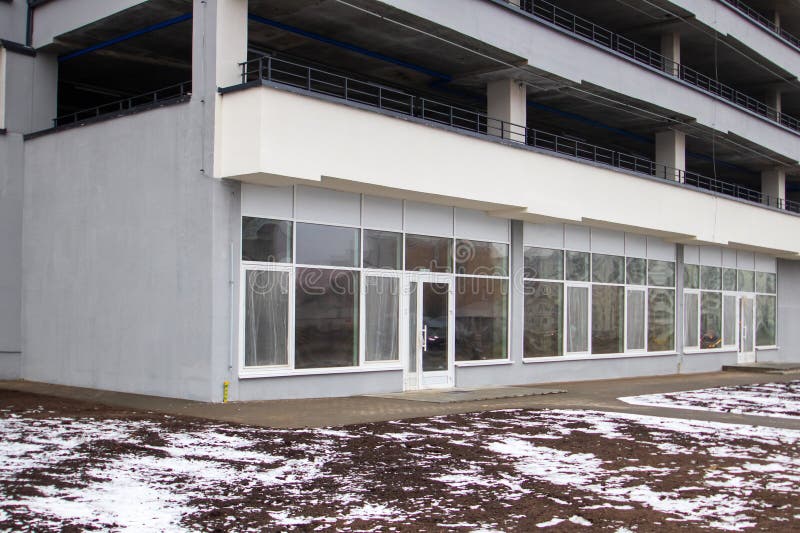 A Large Building that Features Numerous Windows and Multiple Doors ...