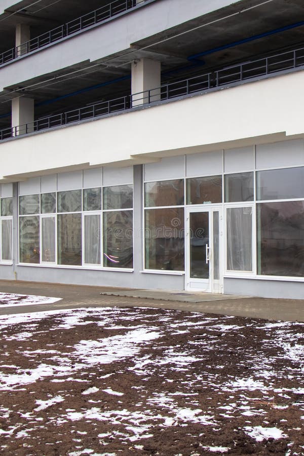 A Large Building that Features Numerous Windows and Multiple Doors ...