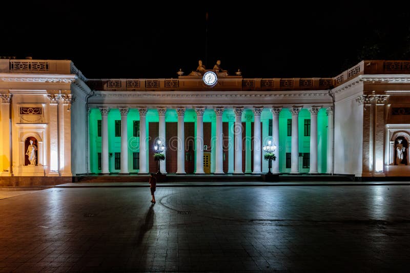 A Large Building with a Green Facade is Lit Up at Night Stock Image ...