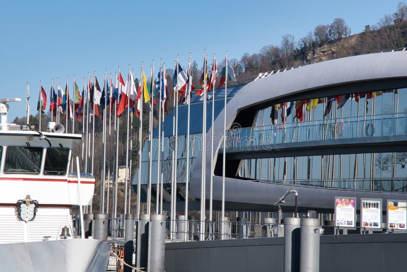 A Large Building with Mulnational Flags Editorial Photography - Image ...