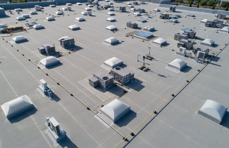 A Large Building with Many Vents and a Roof Stock Photo - Image of ...