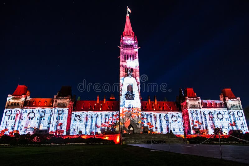 A Large Building with a Red Roof and a Clock Tower Stock Image - Image ...