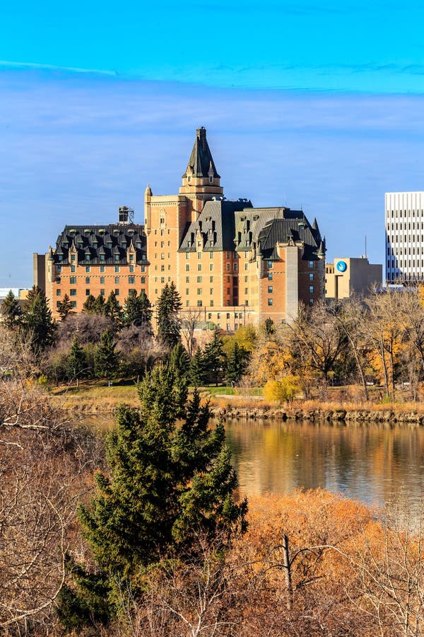 A Large Building with a Tower and a Lake in the Background Editorial ...