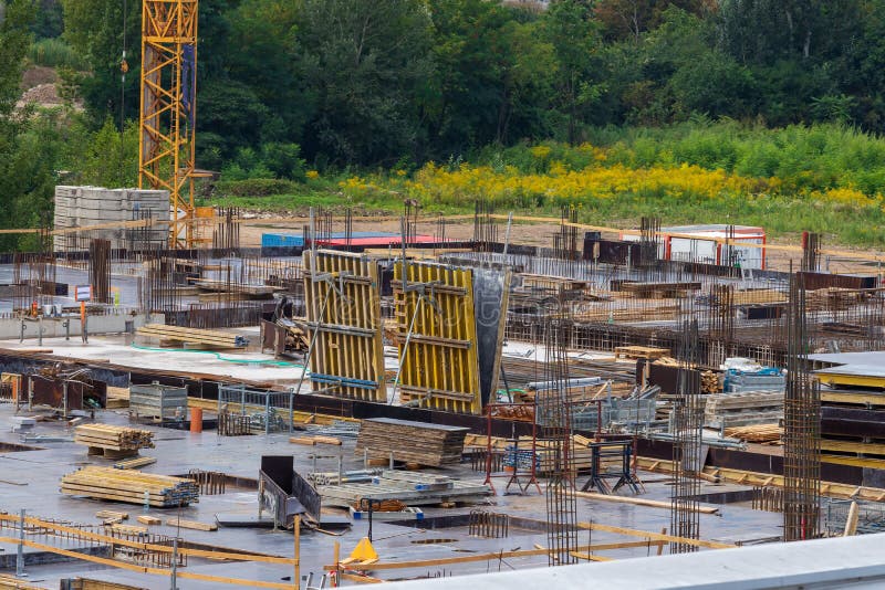 Large Building Under Construction. There is Concrete, Wires, Machines ...