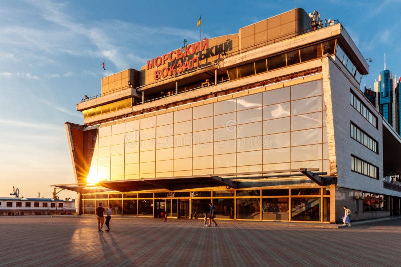 A Large Building with a Large Window and a Sun Shining on it Editorial ...