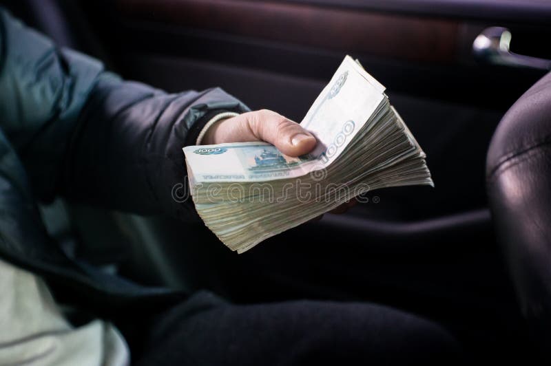 A Large Bundle of Russian Money is Squeezed in His Hand. Stock Photo ...