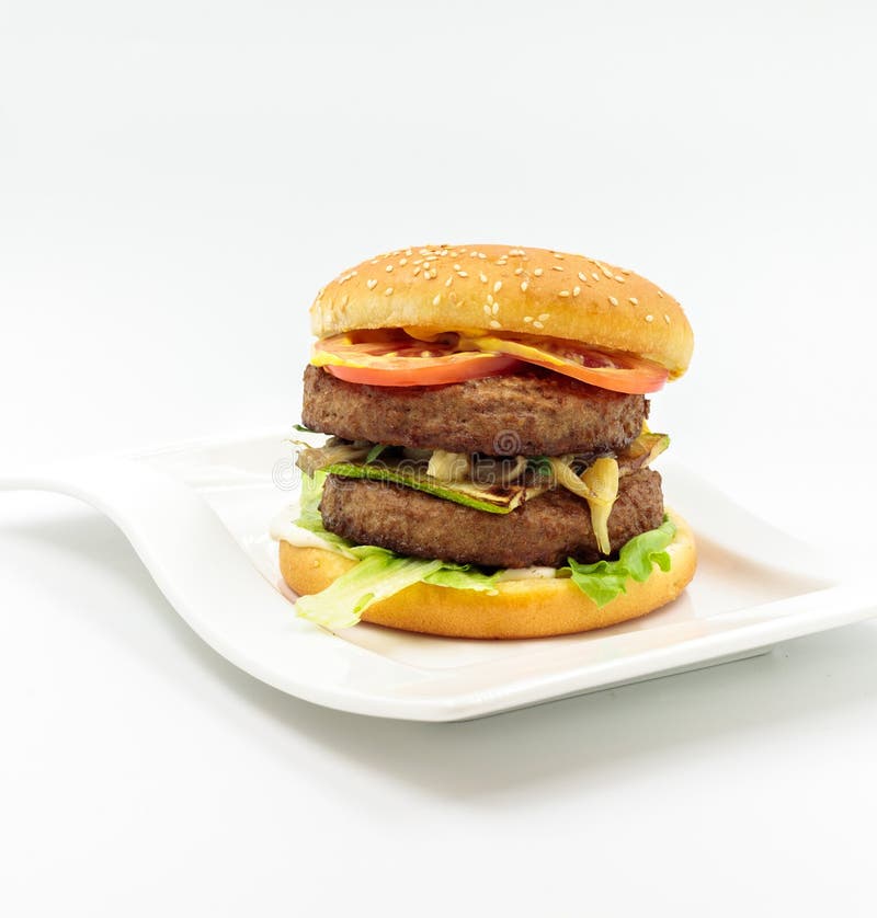 A Large Burger with a Double Cutlet, Grilled Vegetables and Sauce ...