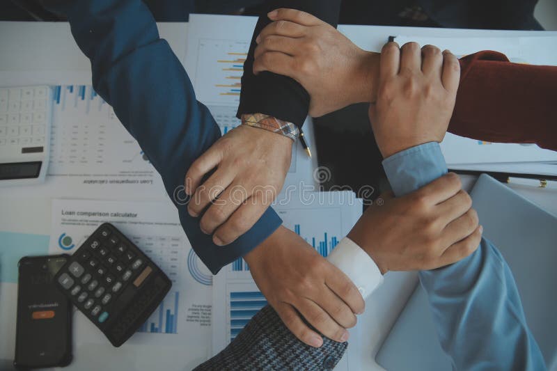 Large Business Team Showing Unity with Their Hands Together Stock Photo ...