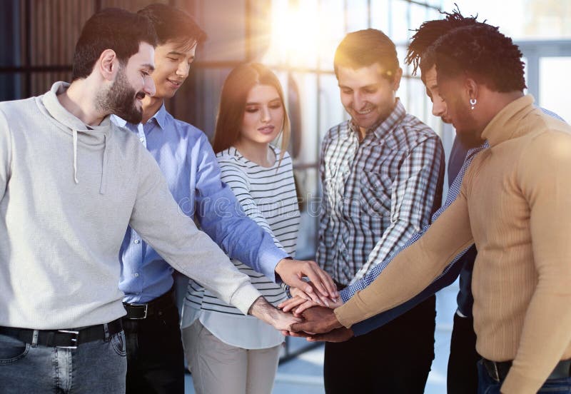Large Business Team Showing Unity with Their Hands Together Stock Image ...