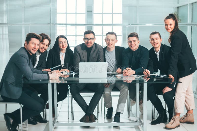 Large Business Team Sitting at an Office Desk Stock Image - Image of ...
