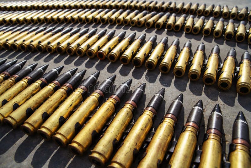 Large Caliber Shells. Many Bullets for Firearms Lie on the Asphalt. No ...