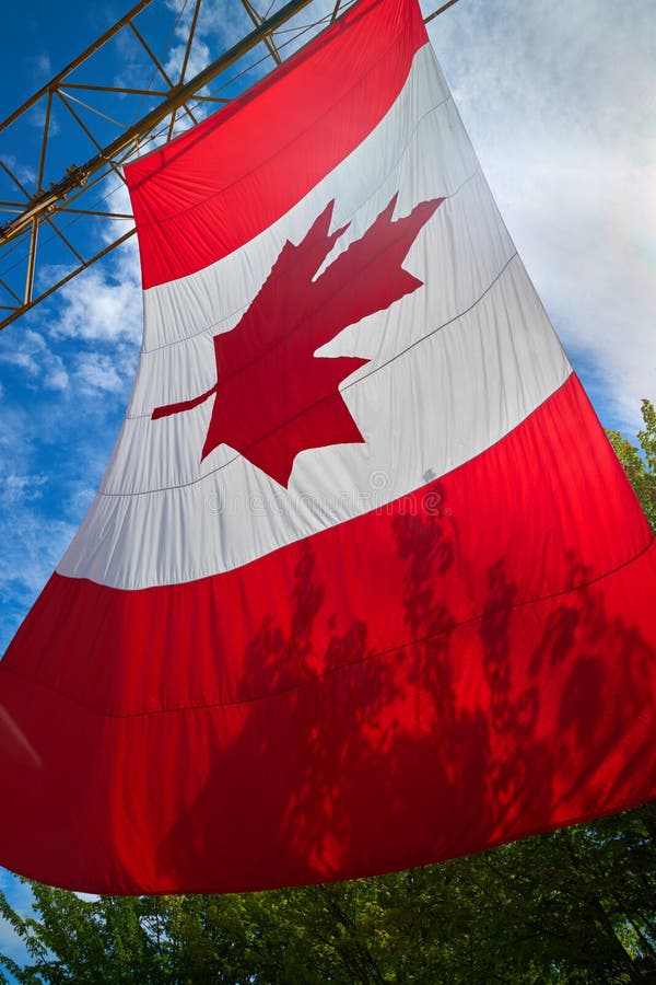 Large Canadian Flag in the Sun Stock Image - Image of flying, scenics ...