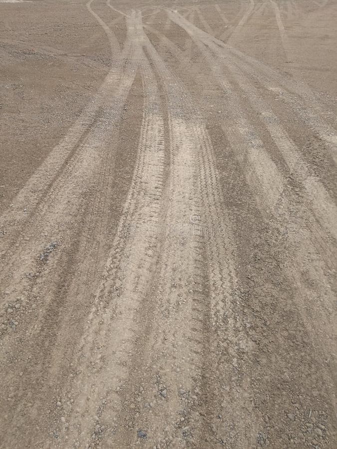 Large Car Tire Marks on Brown Ground Surface Stock Image - Image of ...