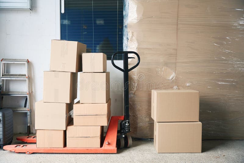 Large Cardboard Boxes on Platform Truck into Warehouse with Self ...