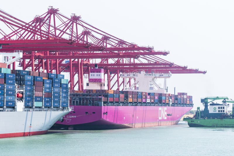 Large Cargo Container Ship Berthed At The Container Terminal Under