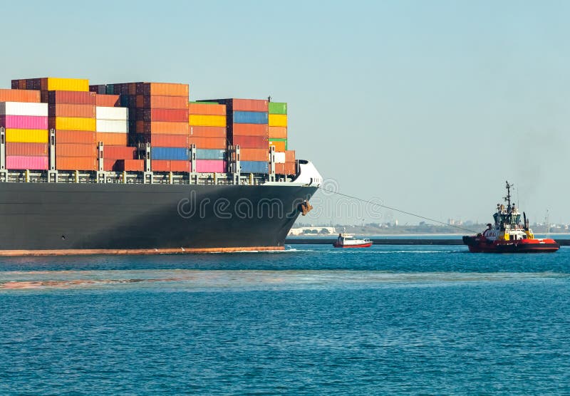 Large Cargo Container Ship Loaded with Containers Against the Blue Sky ...