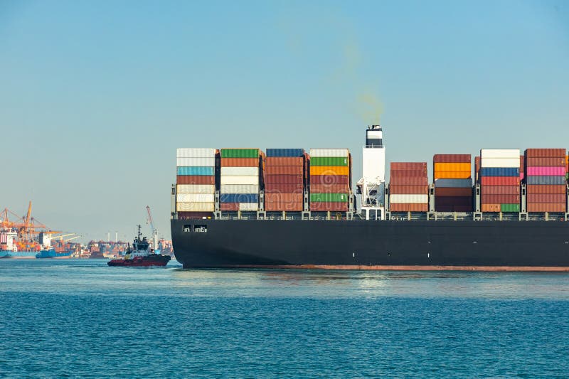 Large Cargo Container Ship Loaded with Containers Against the Blue Sky ...