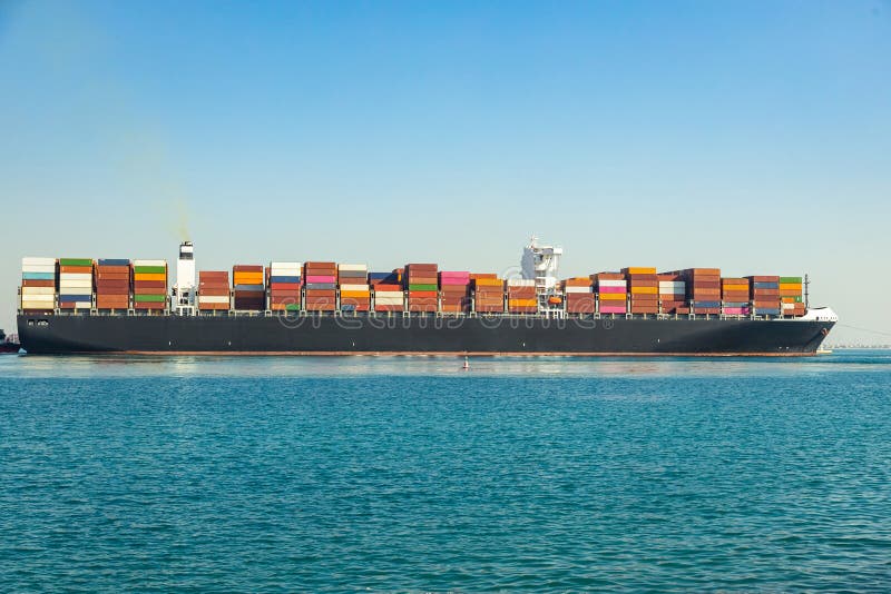 Large Cargo Container Ship Loaded with Containers Against the Blue Sky ...