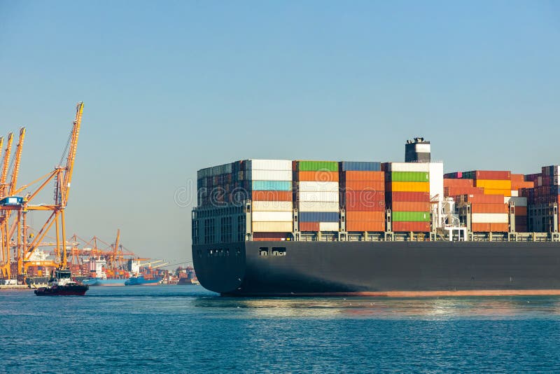 Large Cargo Container Ship Loaded with Containers Against the Blue Sky ...