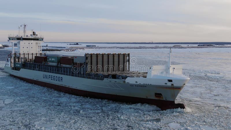 A Large Cargo Ship with Containers Floats on the Sea in the Middle of ...