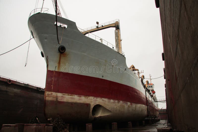 A Large Cargo Ship or Freighter Docked at a Shipyard Stock Image ...