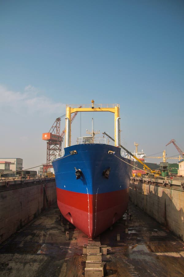 A Large Cargo Ship or Freighter Docked at a Shipyard Stock Image ...