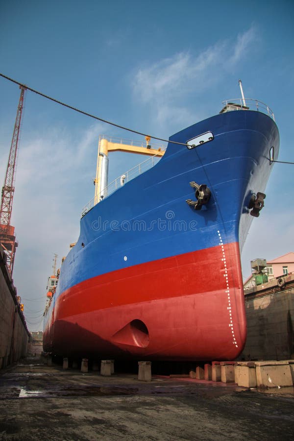 A Large Cargo Ship or Freighter Docked at a Shipyard Stock Image ...