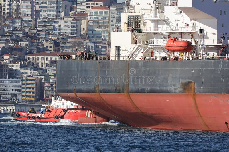 Large Cargo Ship Navigating the Bosphorus with Istanbul City Skyline in ...