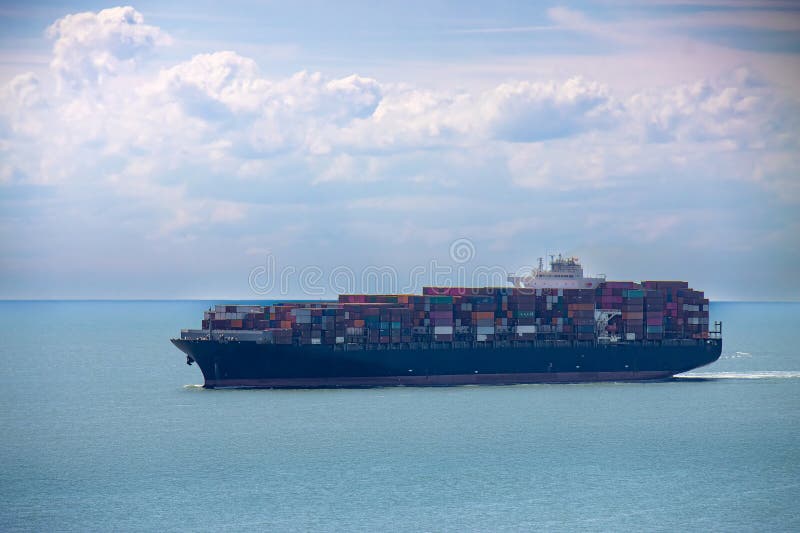 Large Cargo Ship Transporting Containers Across Ocean Stock Photo ...