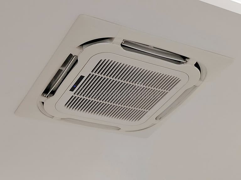 A Large Cassette Type Air Conditioner is Installed on the Ceiling Stock ...