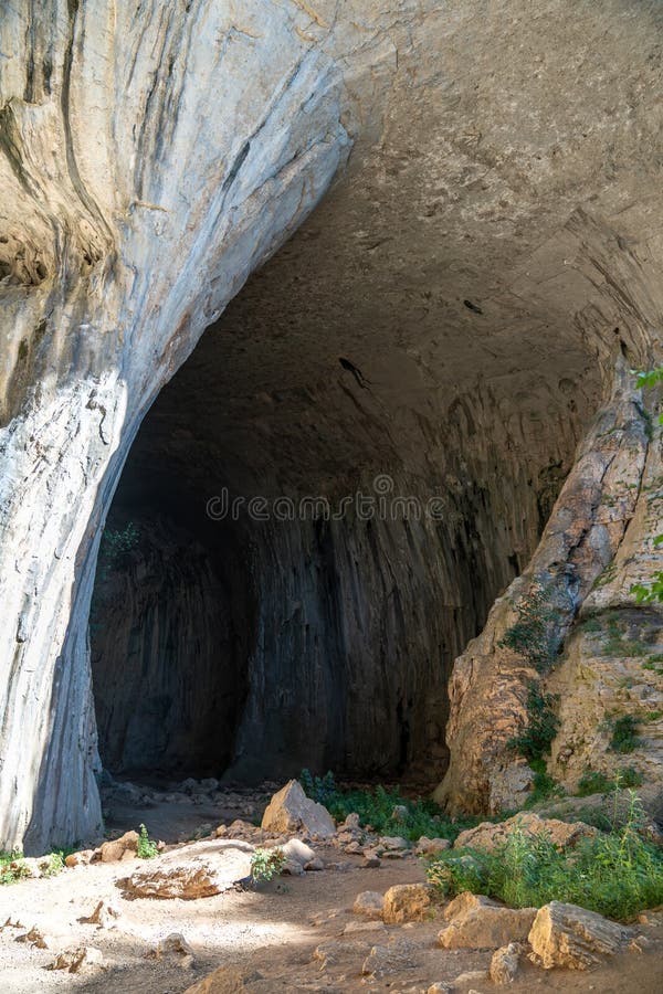 Large Cave Entrance with Sunlight Illuminating the Ground Stock Photo ...