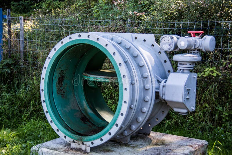 Large check valve at dam stock photo. Image of valve - 189799842