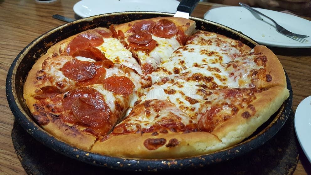 A large cheese pizza stock photo. Image of herbs, pizza - 104341956