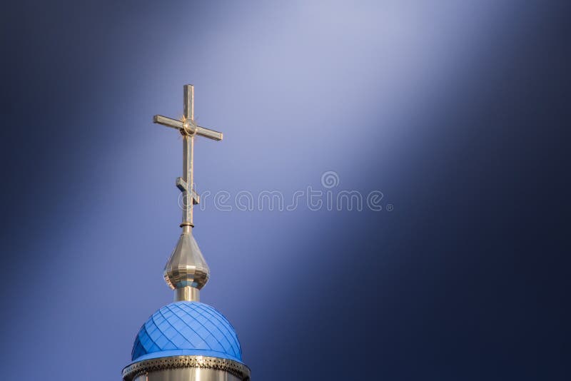 A Large Christian Cross on Which Falls a Ray of Sun through the Clouds ...