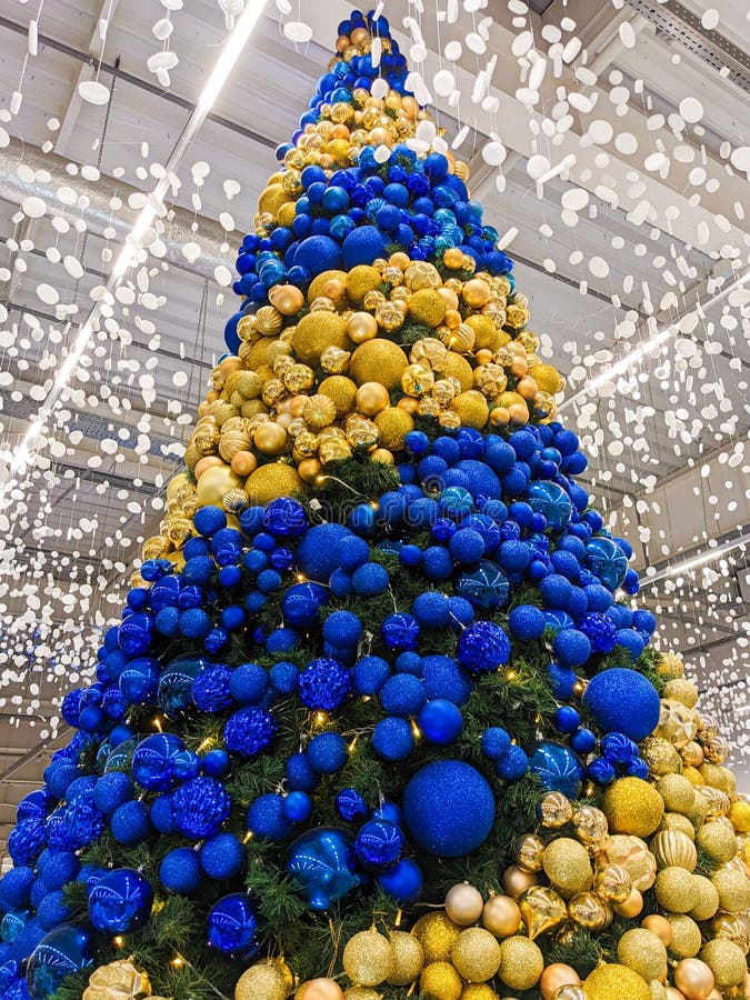 A Large Christmas Tree with Yellow and Blue Balls. Stock Image - Image ...