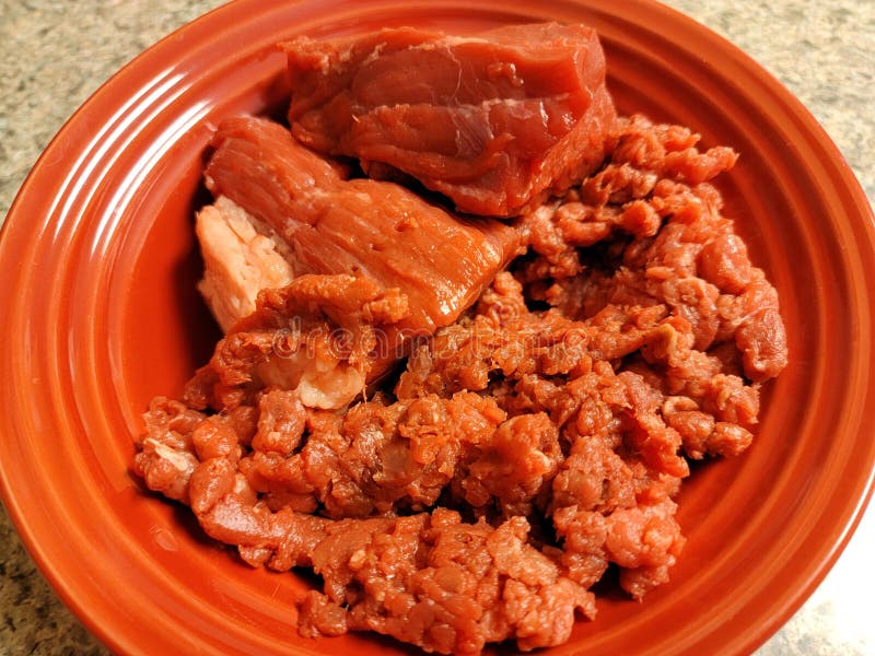 Large Chunks and Ground Raw Red Beef Meat in Red Bowl Stock Image ...