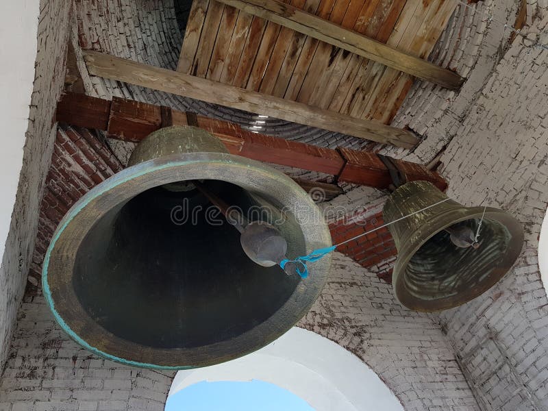 Large Church Bells Hang Under the Arch of the Bell Tower Stock Photo ...