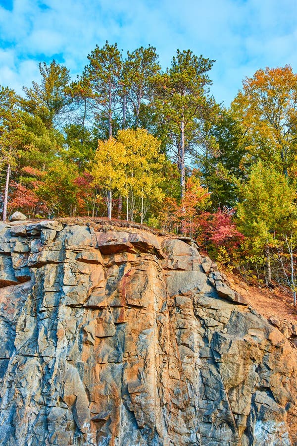 Large Cliff with Colorful Fall Trees Covering Top Stock Photo - Image ...