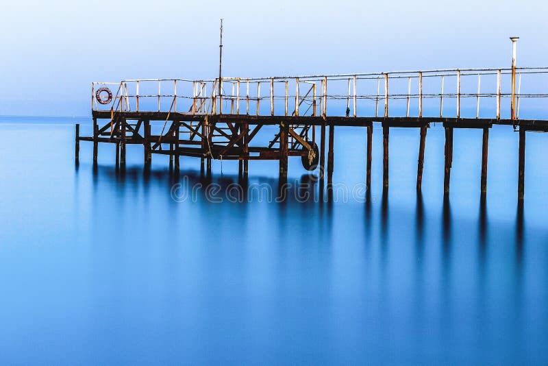 A Large Cloud of Misty an Empty Dock in Morning Calm Wind Stock Photo ...
