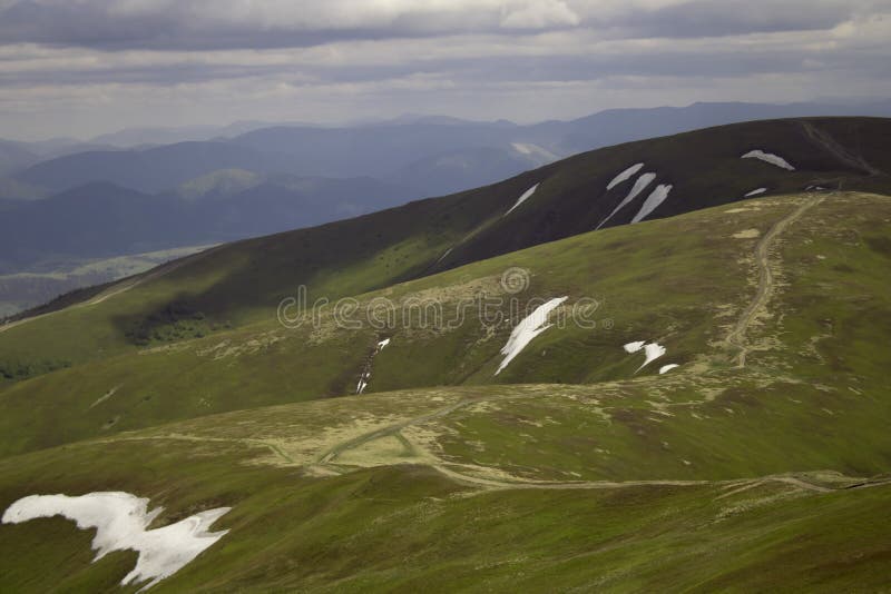 A Large Cloud Shadow Covers the Mountain Peak Stock Image - Image of ...