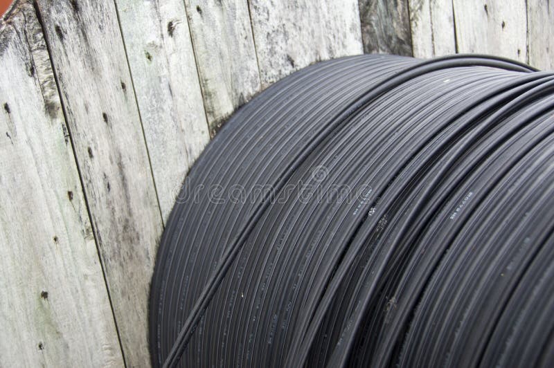 A Large Coil of Black Communication Cable is Outdoors Stock Image ...
